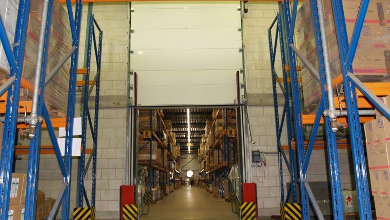 Chemical storage with a liquid retention barrier - Protec Industrial Doors